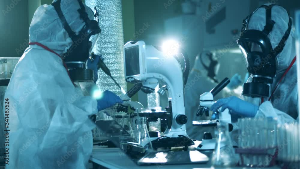 Covid-19 vaccine testing concept, antibodies research. Microbiologists ...