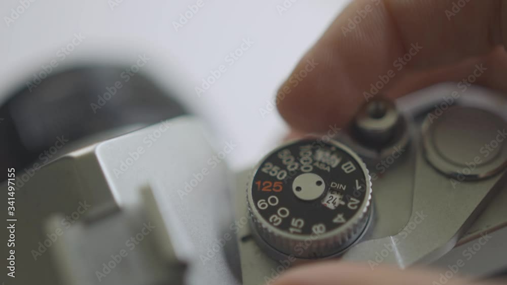 Spinning and turning shutter speed dial on 35mm film vintage still camera SLR Stock ビデオ | Adobe ...