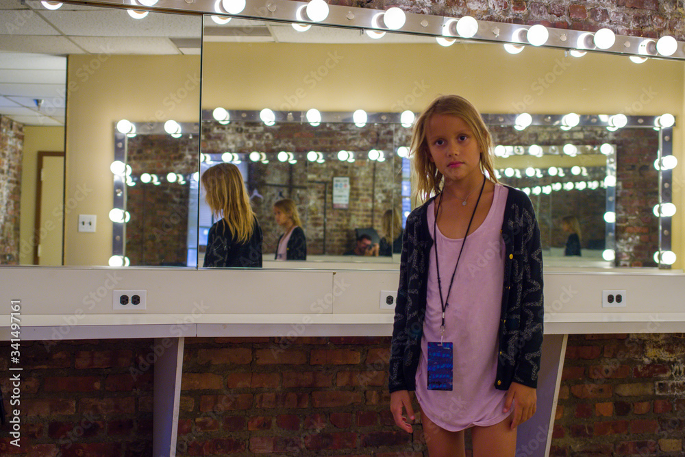 Young girl in a dressing room backstage Stock Photo | Adobe Stock