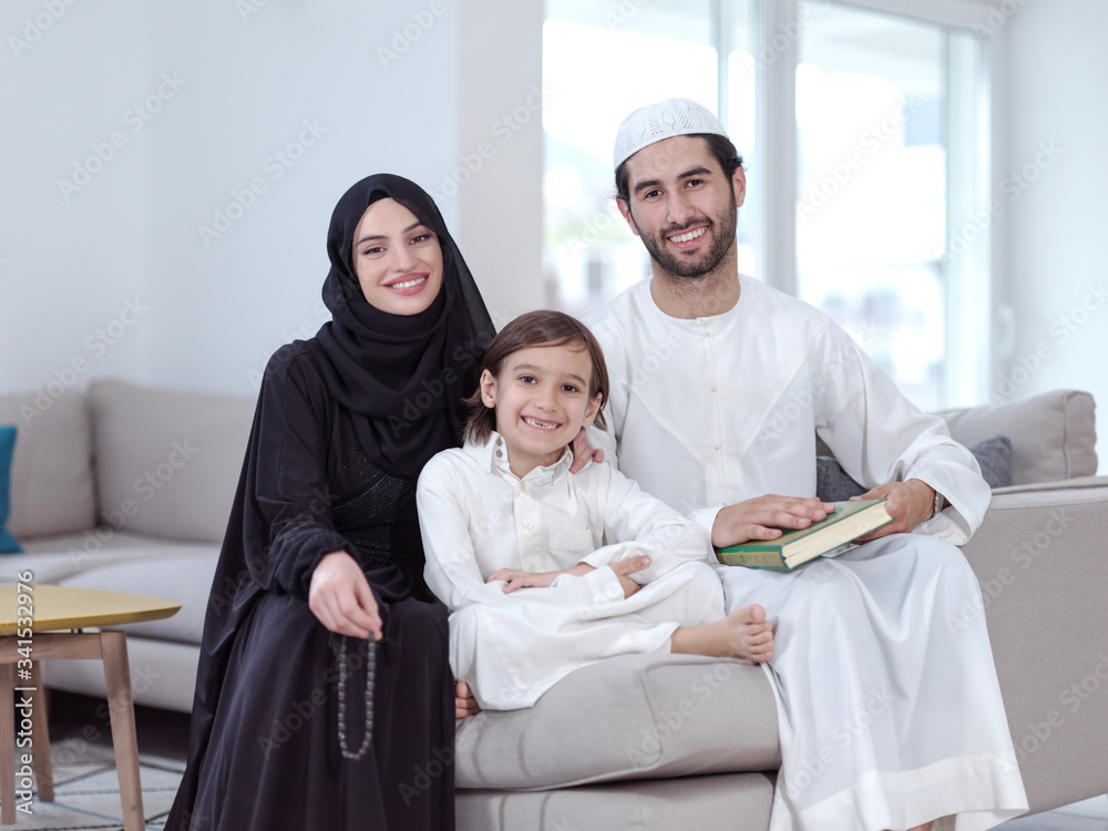 muslim family reading Quran and praying at home Stock Photo | Adobe Stock