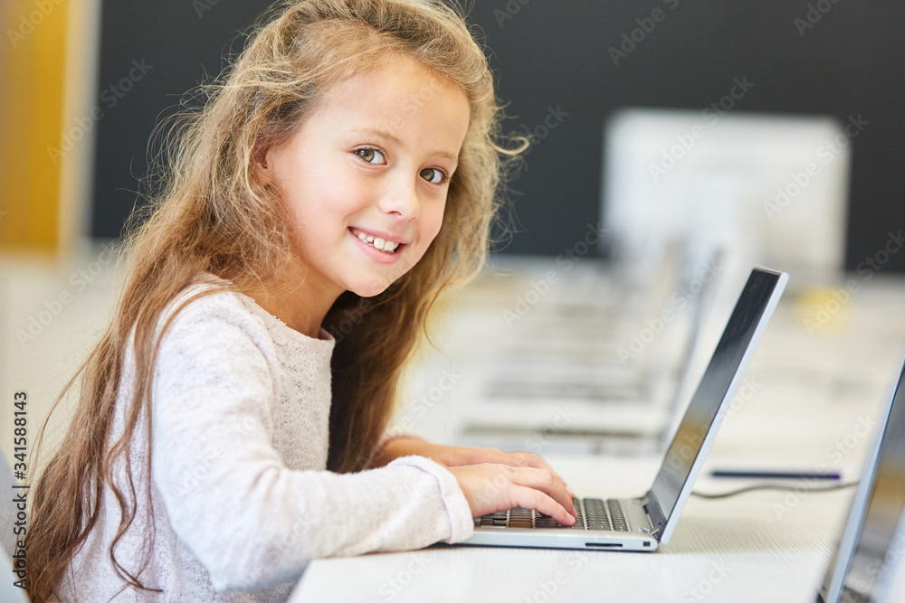Happy girl with tablet computer Stock Photo | Adobe Stock