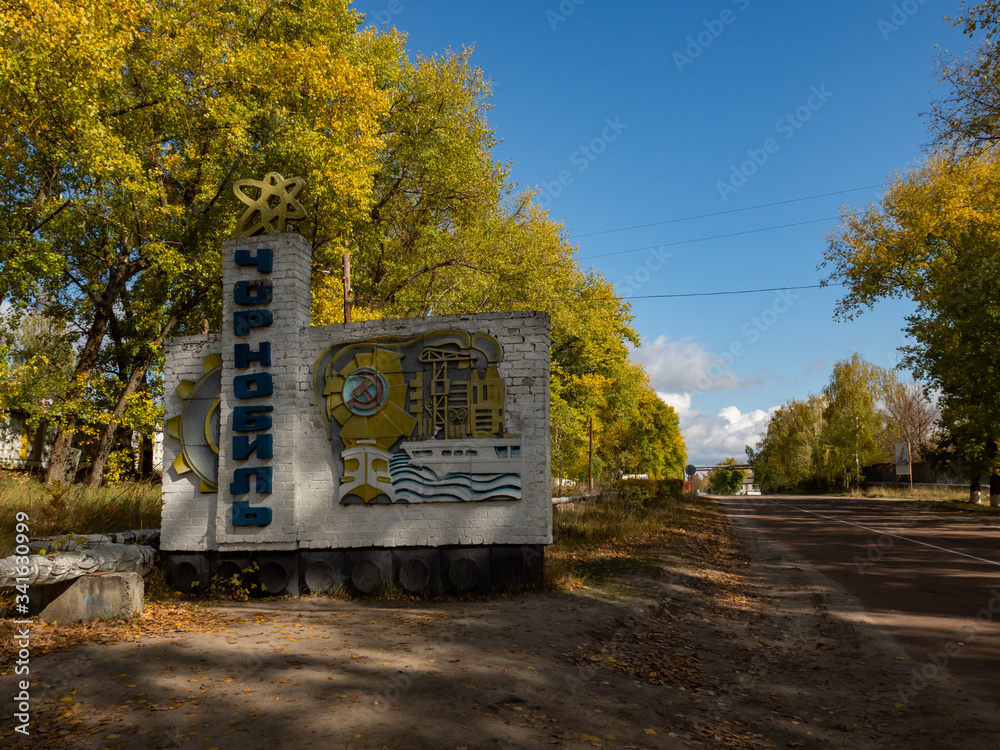 Road and town sign at the entrance of the abandoned city of Chernobyl ...