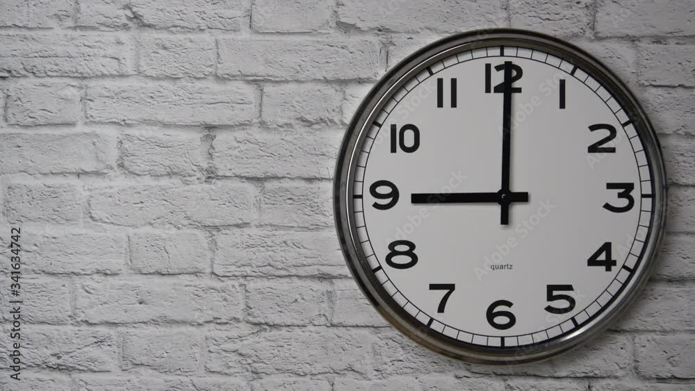 The Time On The Clock Nine. Clock With The Black Arrows With The Arabic ...