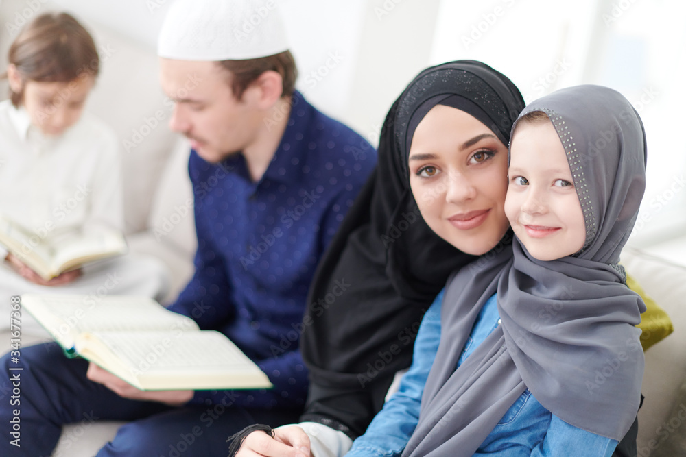 muslim family reading Quran and praying at home Stock Photo | Adobe Stock