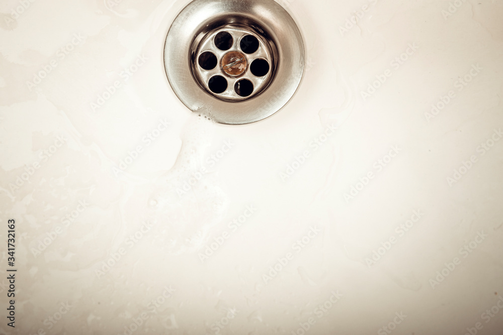 Water draining at sink background. Water flowing drain in washbasin ...