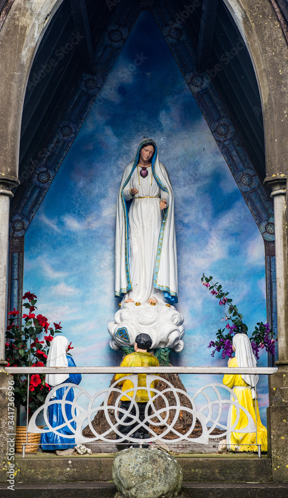 Close up on Roadside shrine of the Virgin Mary in rural Ireland ...