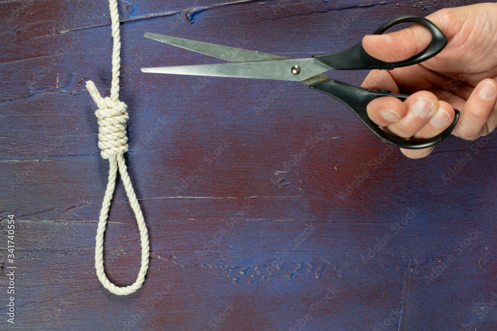 Gallows of white rope with one hand wielding scissors insinuating the ...