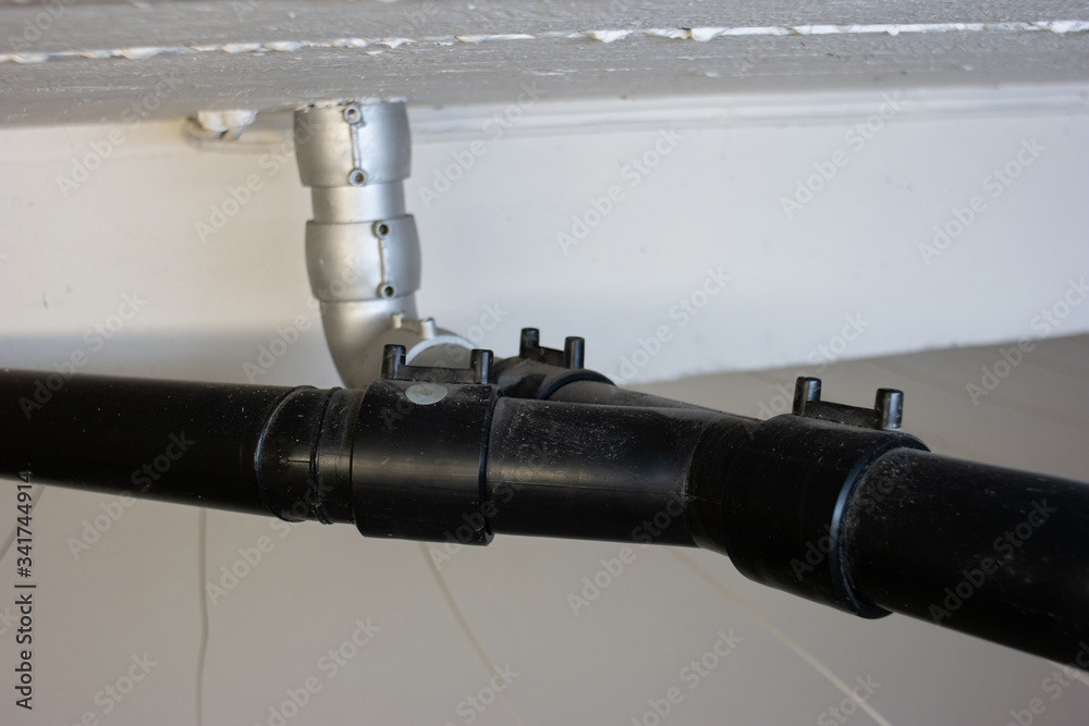 Domestic use water supply piping network silver and black pipes with ...