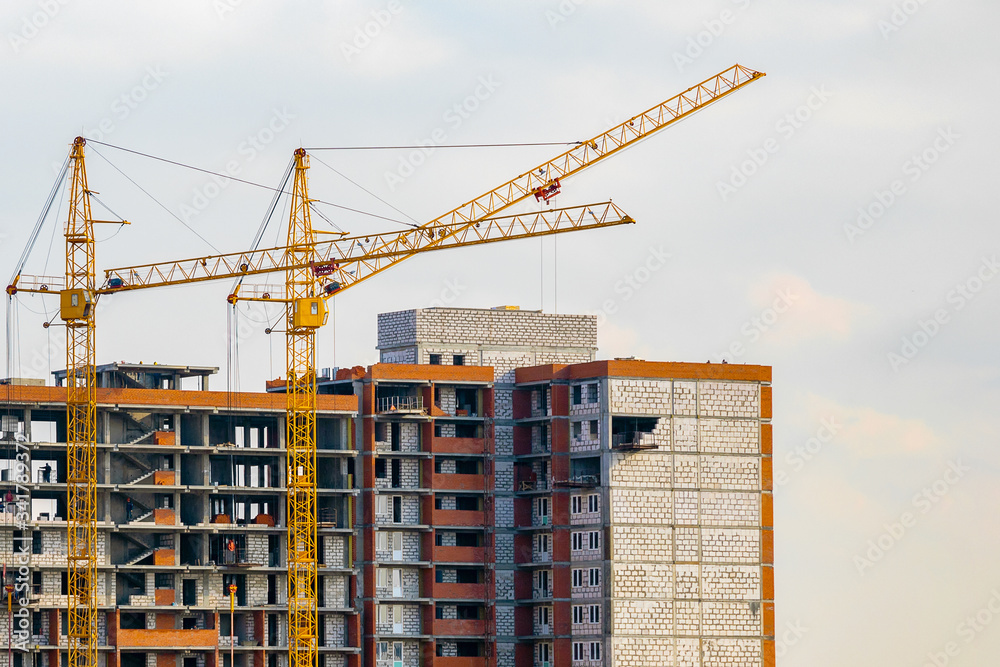 building a house with a high-rise crane Stock Photo | Adobe Stock