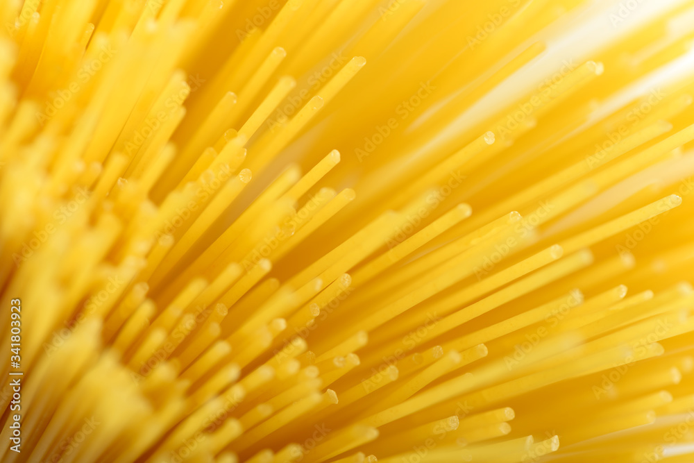 Long yellow spaghetti pasta food ingredient. Uncooked dry macaroni ...