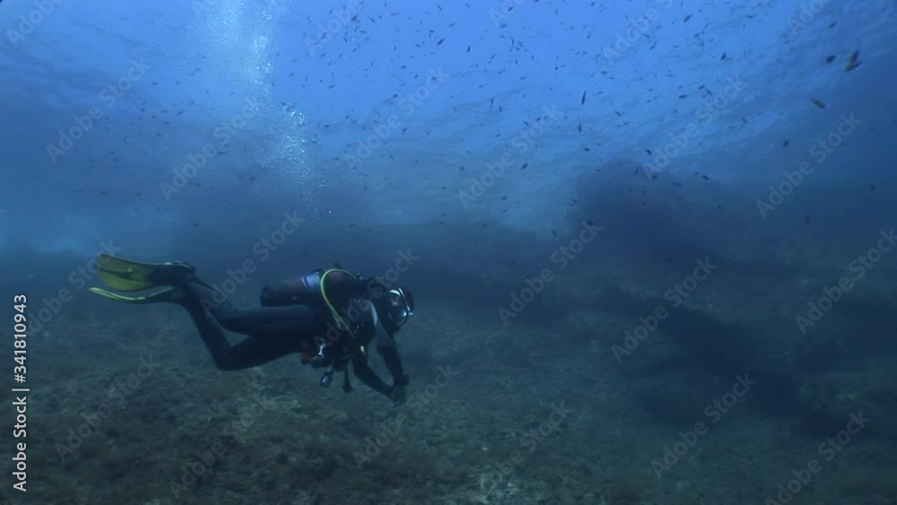 scuba diver exploring the ship wreck underwater shipwreck scenery from ...