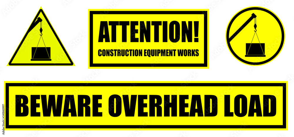 Set of danger signs of working construction equipment on a yellow ...