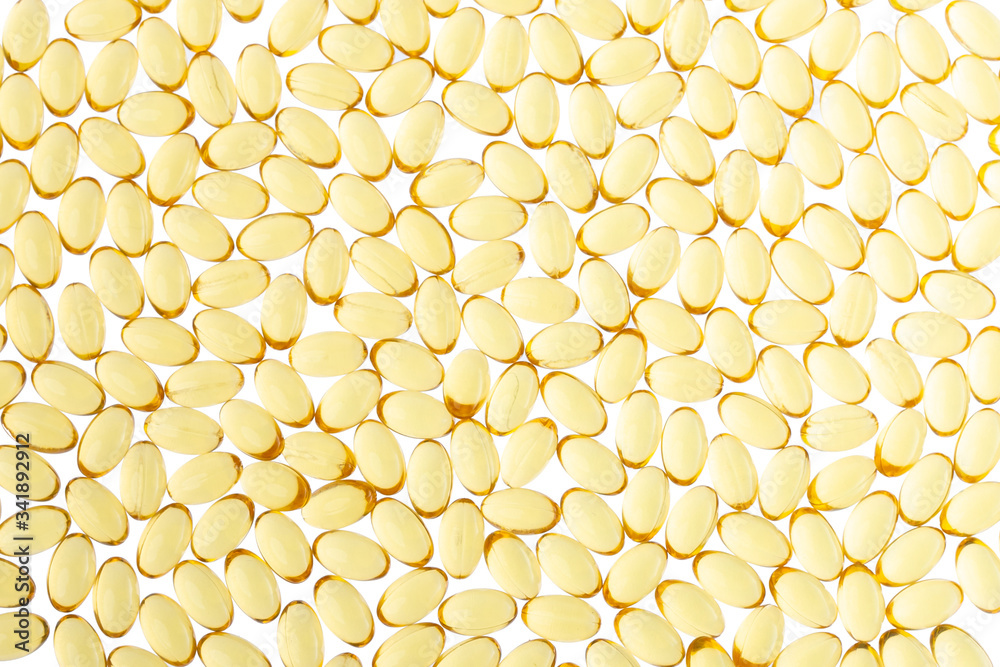 Softgels of Omega-3 on isolated background. Texture of yellow capsules ...
