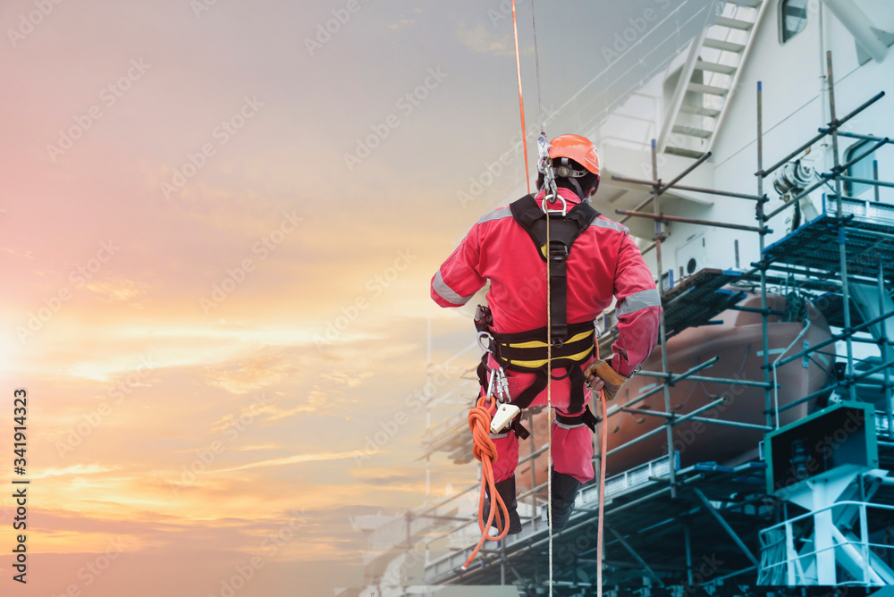 Safety first, Rope access Worker on high Abseiling of high wearing ...