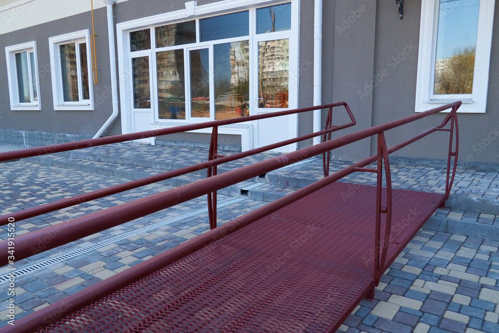 Wheelchair access ramp for entrance of residential multistory building ...