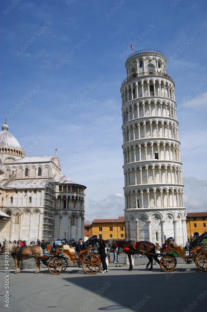 Horse Carts By Leaning Tower Of Pisa On Street In City Stock Photo ...