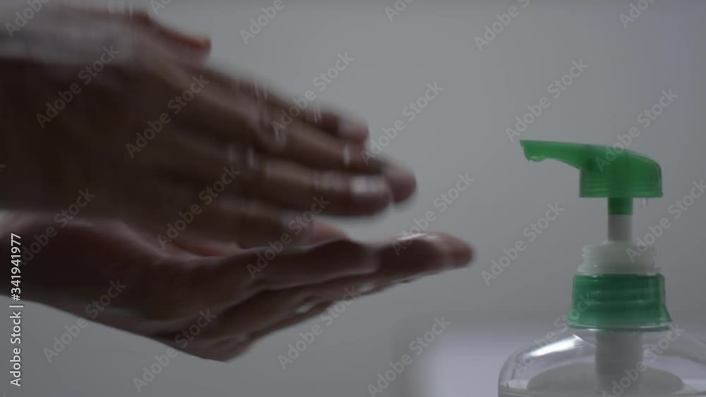 Person hand pressing liquid soap dispenser for cleaning his hand to ...