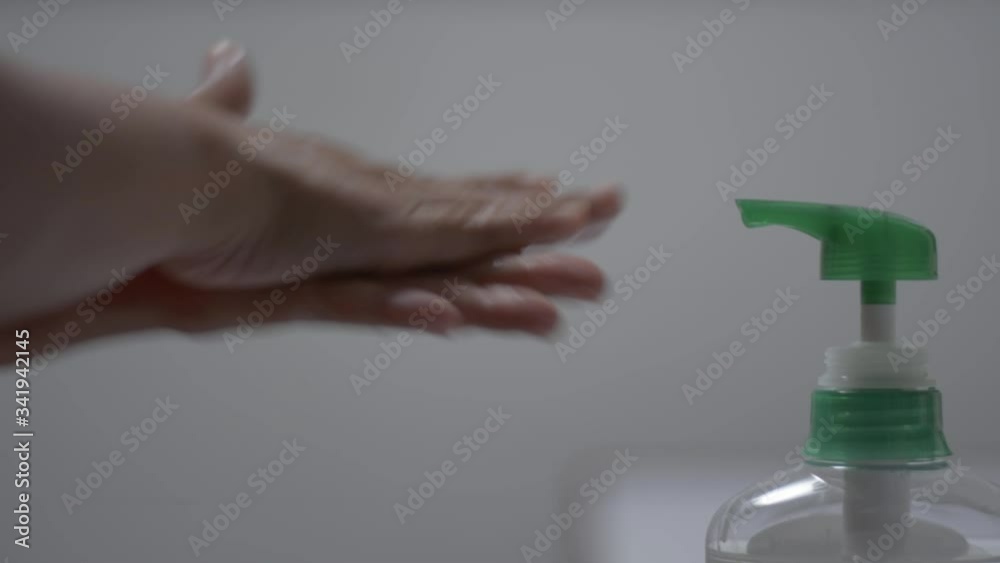Person hand pressing liquid soap dispenser for cleaning his hand to ...