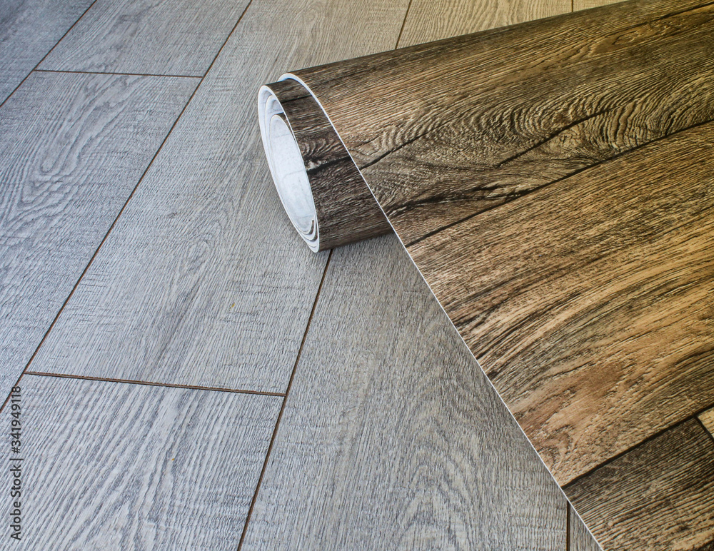 Roll of linoleum with a wood texture. Types of floor coverings. Stock ...