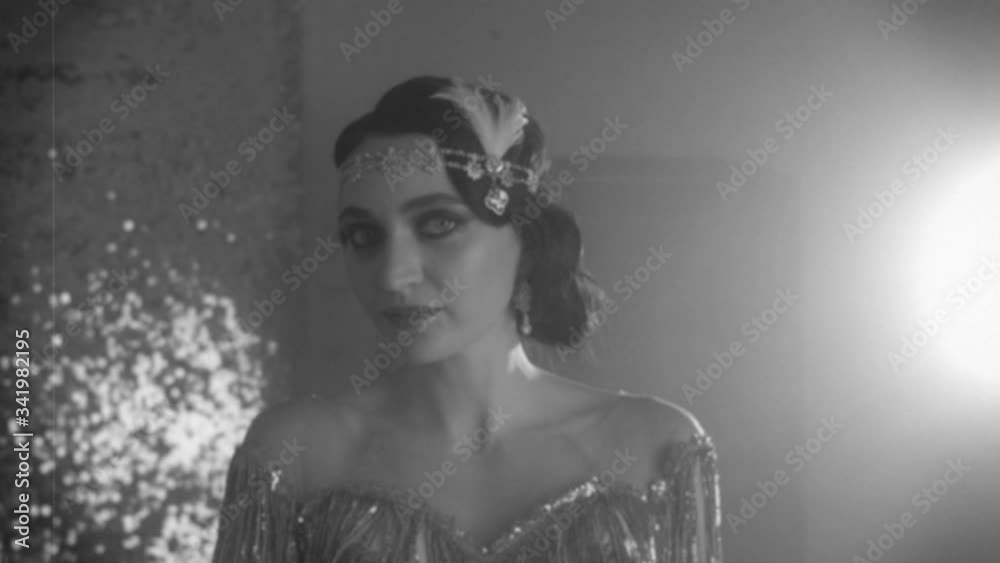 black and white old film 1920s style. Sad face young retro woman ...