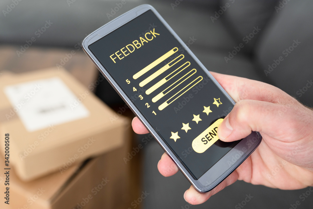 close-up of person giving positive feedback on smartphone after ...