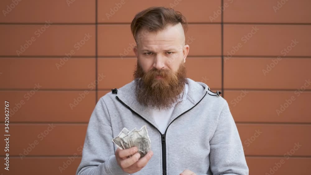 portrait of sad man who lost his job,financial crisis,holding last ...