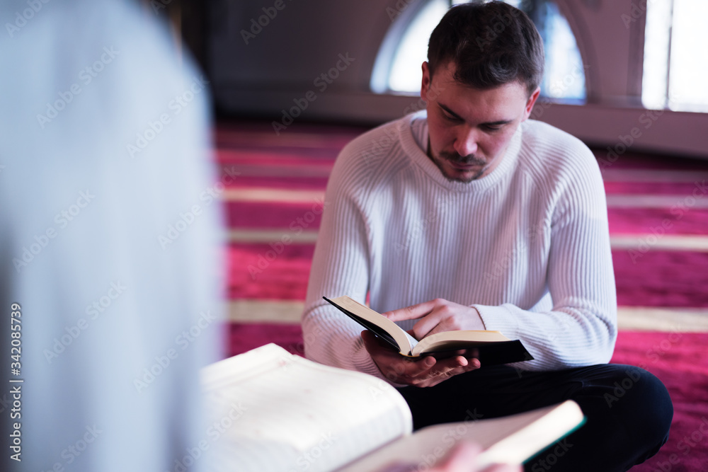 Muslim father and son praying together. Muslim dad and son praying in ...