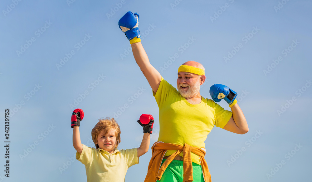 Father is training his son boxing. Little boy sportsman at boxing ...