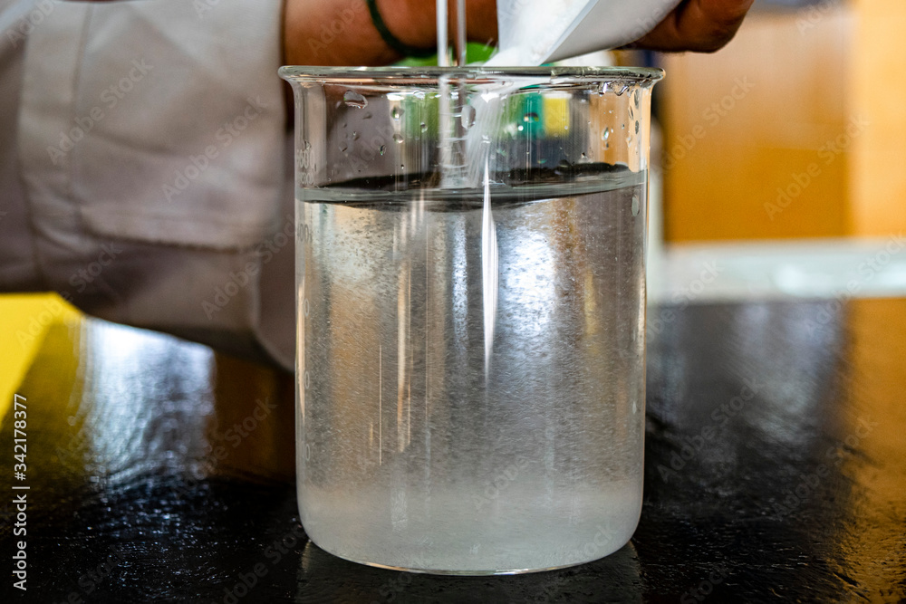 dissolution of particles in water being prepared in the laboratory ...