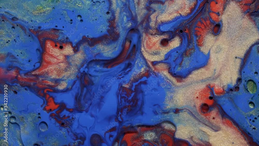 Colorful gold dust blue and red paint flow on silver and universe ...