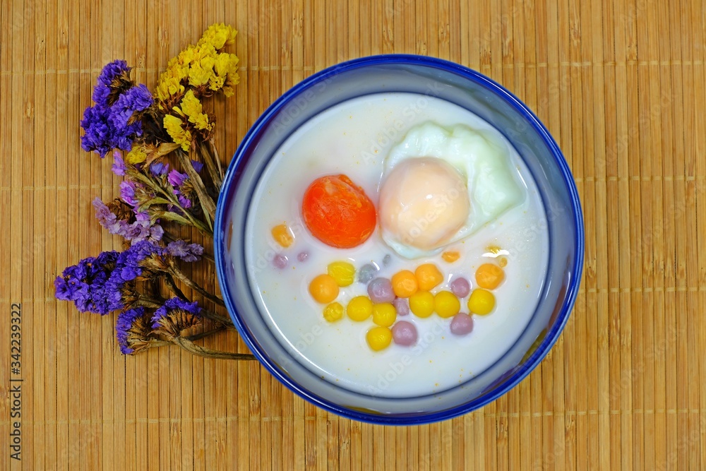 Thai rice balls in sweet coconut milk with salted egg yolk and sweet ...