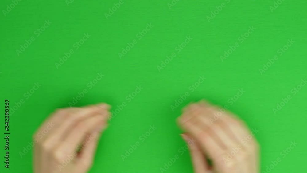 Female hands demonstrate the movement of grabbing, picking something ...