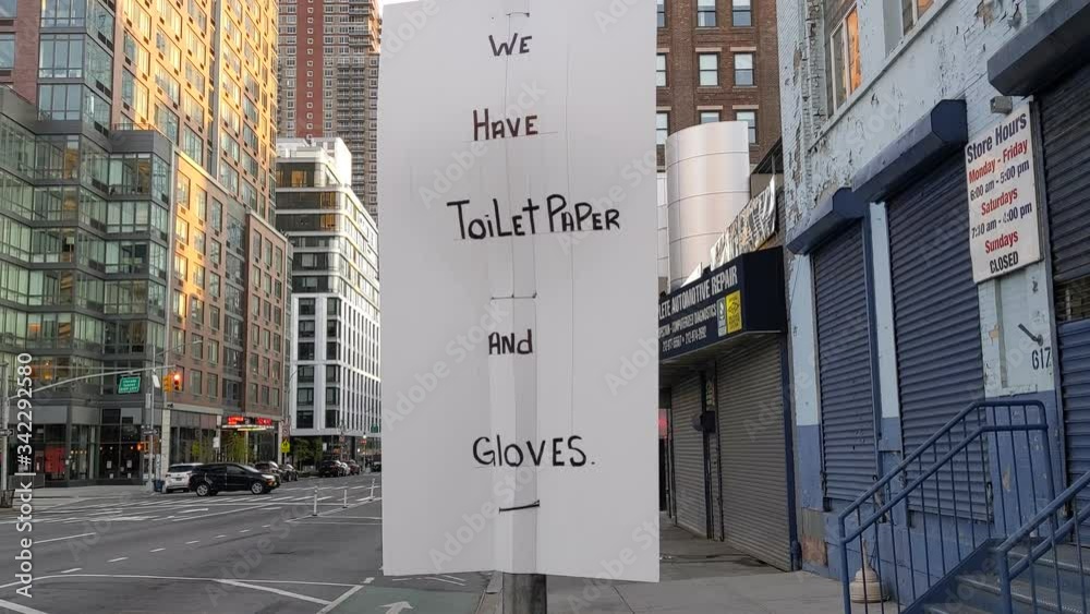Vidéo Stock Large handwritten sign hanging on a pole on a New York City ...