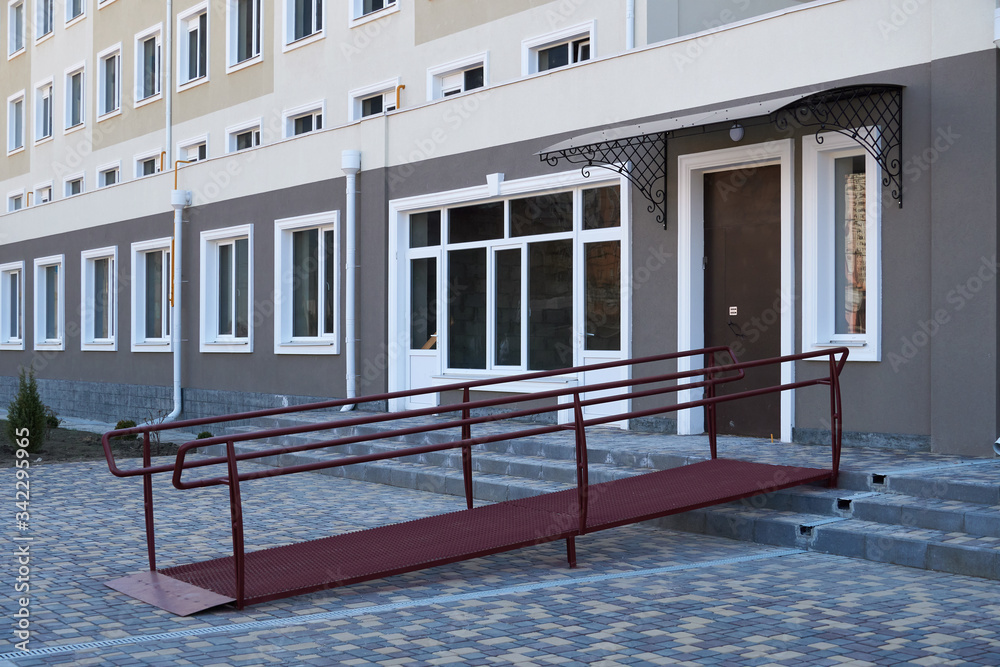 Wheelchair access ramp for entrance of residential multistory building ...