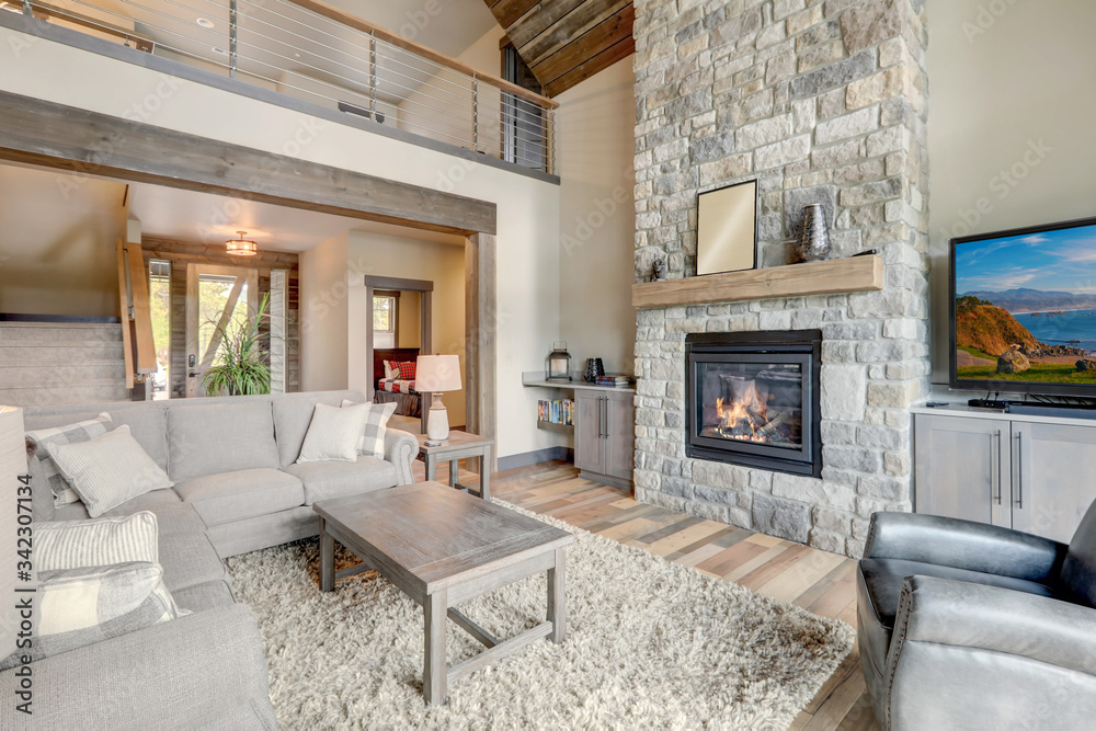 Living room luxury interior with large stone fireplace and leather ...