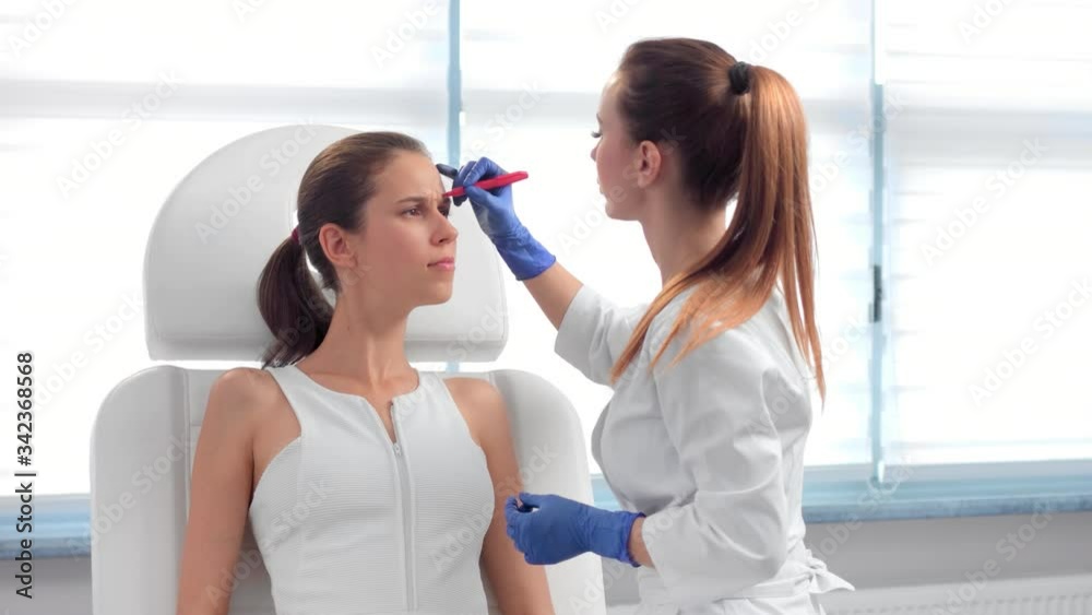 Marking up face before the cosmetology treatment #J8IC149n Stock Video ...