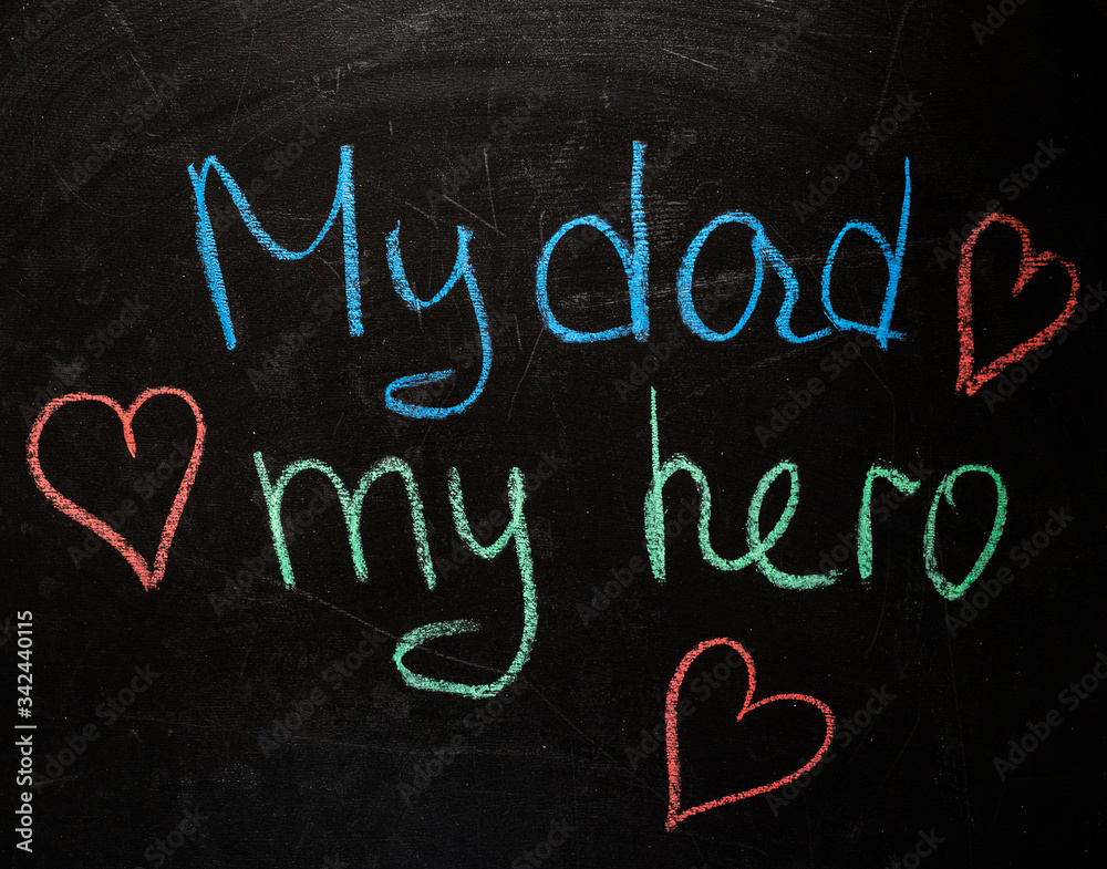 Hand writing fathers day on chalkboard on wood background. Father day ...