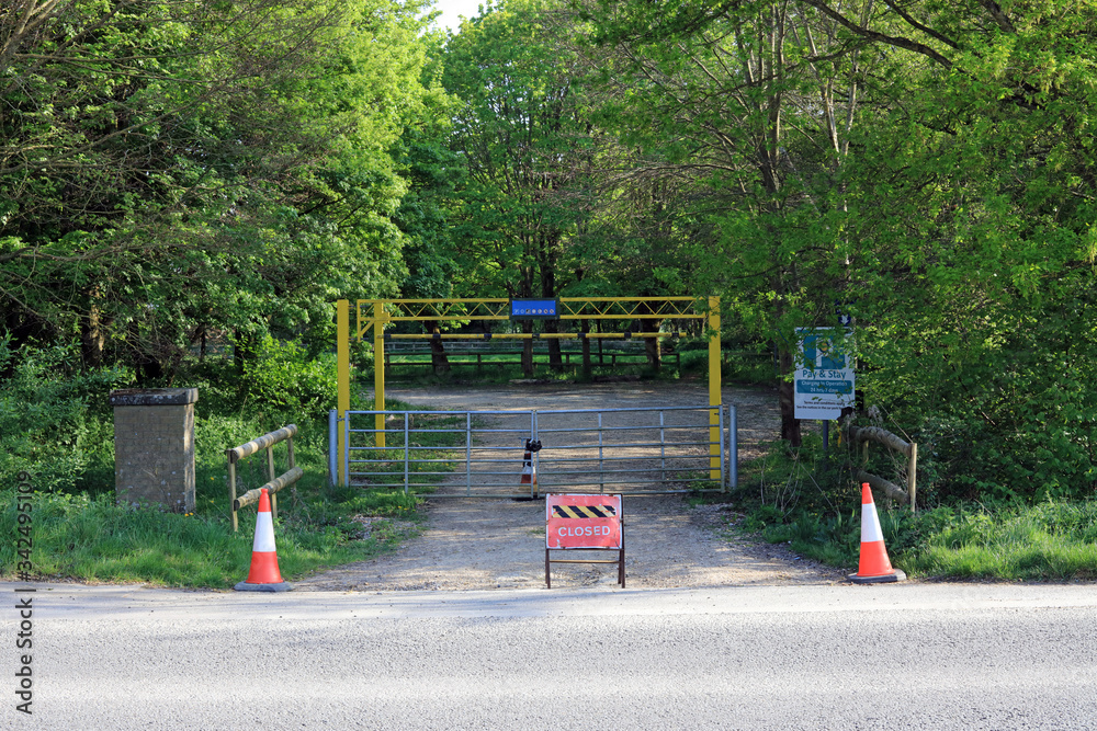 An old closed sign on the entrance to a English countryside car park ...