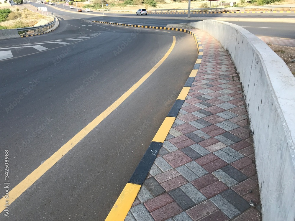 Tarmac or asphalt Road highways ways With concrete barrier along with ...