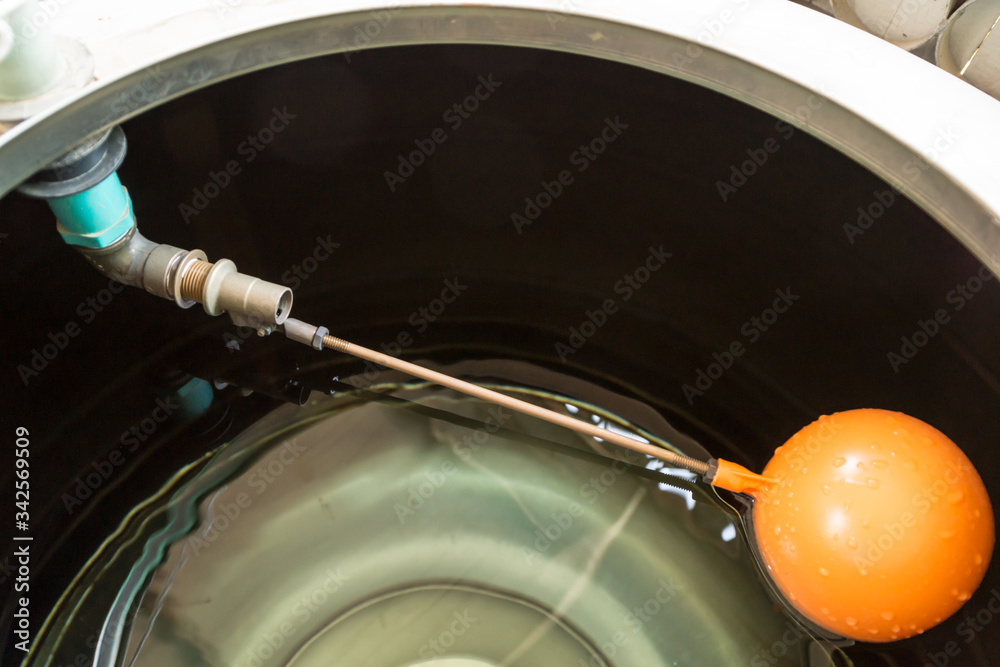 New float ball valve in stainless steel water tank. Stock Photo | Adobe ...