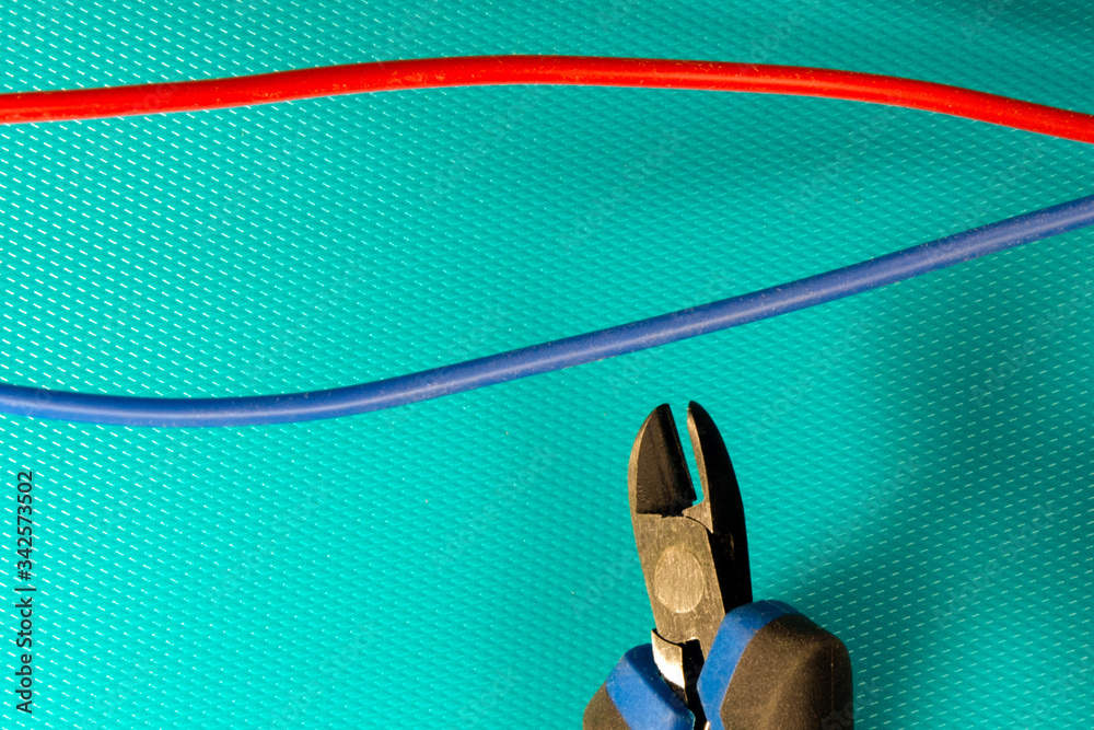Cutting red or blue wire by wire cutters. Safety precautions, bomb ...
