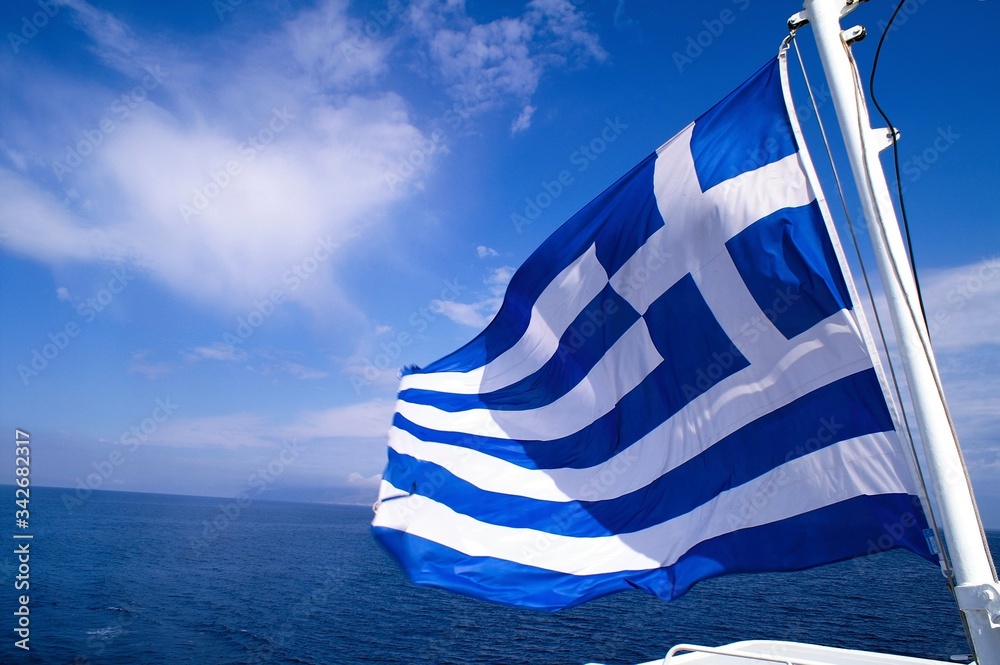 Greece, Aegean sea, Cyclades islands, travelling to Mykonos, Greek flag ...