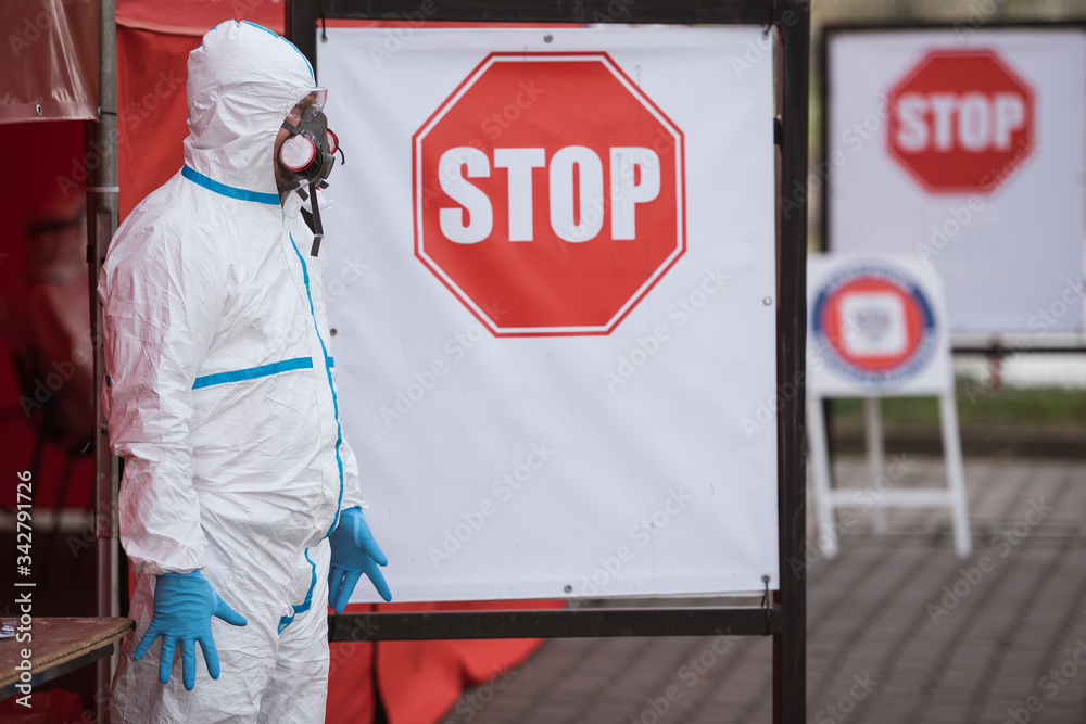 Employee of the medical laboratory and inscription "STOP" at the point ...