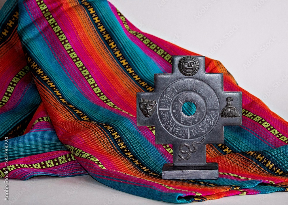 Inca cross chakana and fabric with Inca design patterns Stock Photo ...