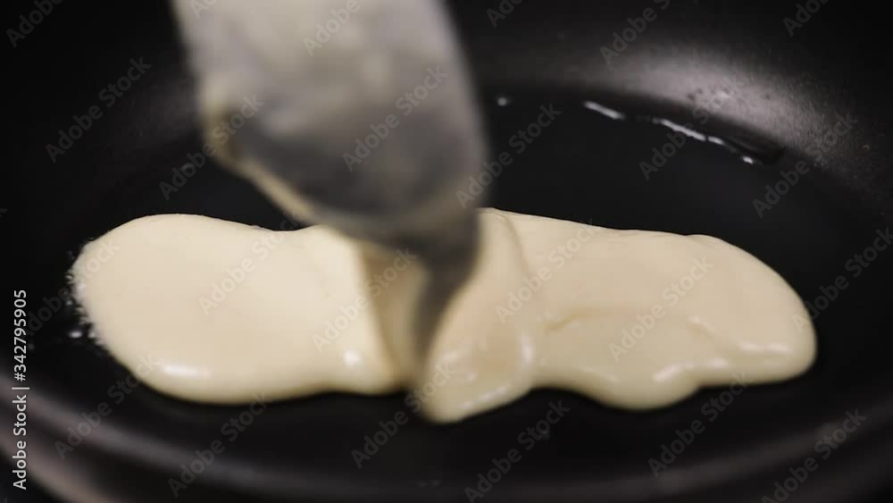 Close up shot of gluten-free pancake batter mix, being poured into the ...