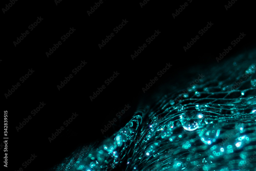 Background and backsplash of wet net with moist crystal water drops ...