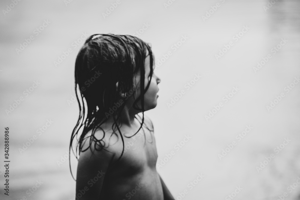 Shirtless Girl Standing At Beach Stock Photo | Adobe Stock