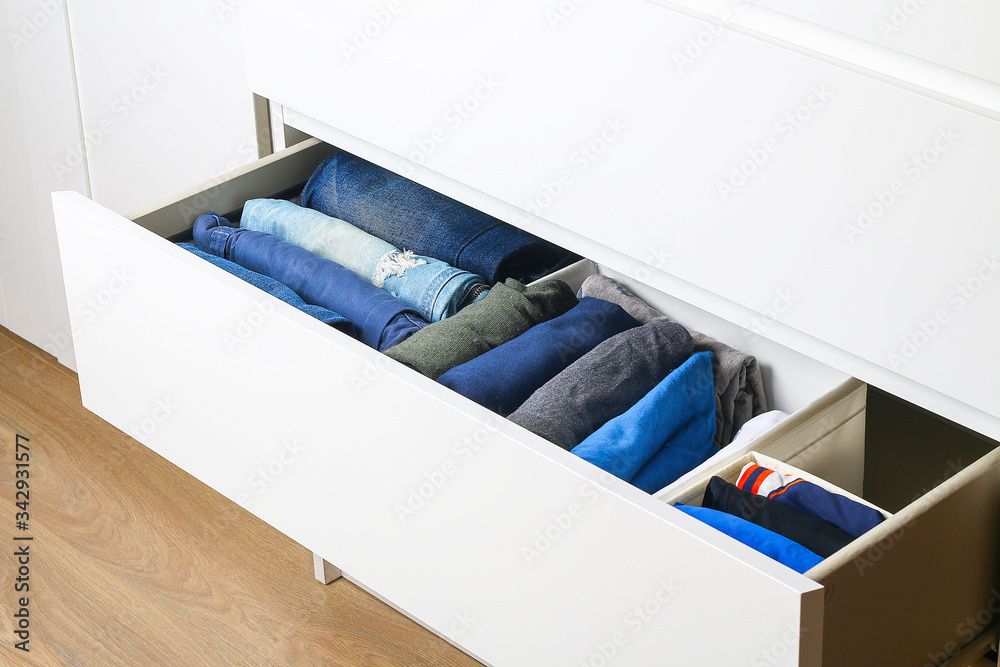 Pants folded according to the method of Marie Kondo. Vertical storage ...