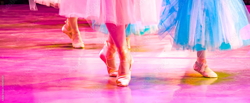 colorful ballet, female legs in pointe shoes on stage, large, blue and ...