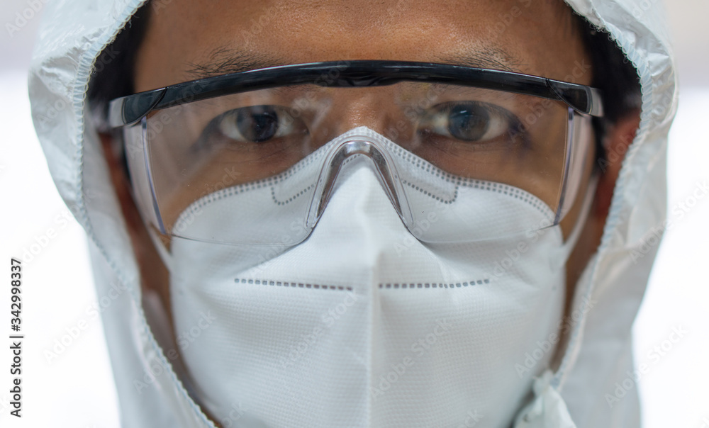 close up picture of asian doctor wearing personal protective equipment ...